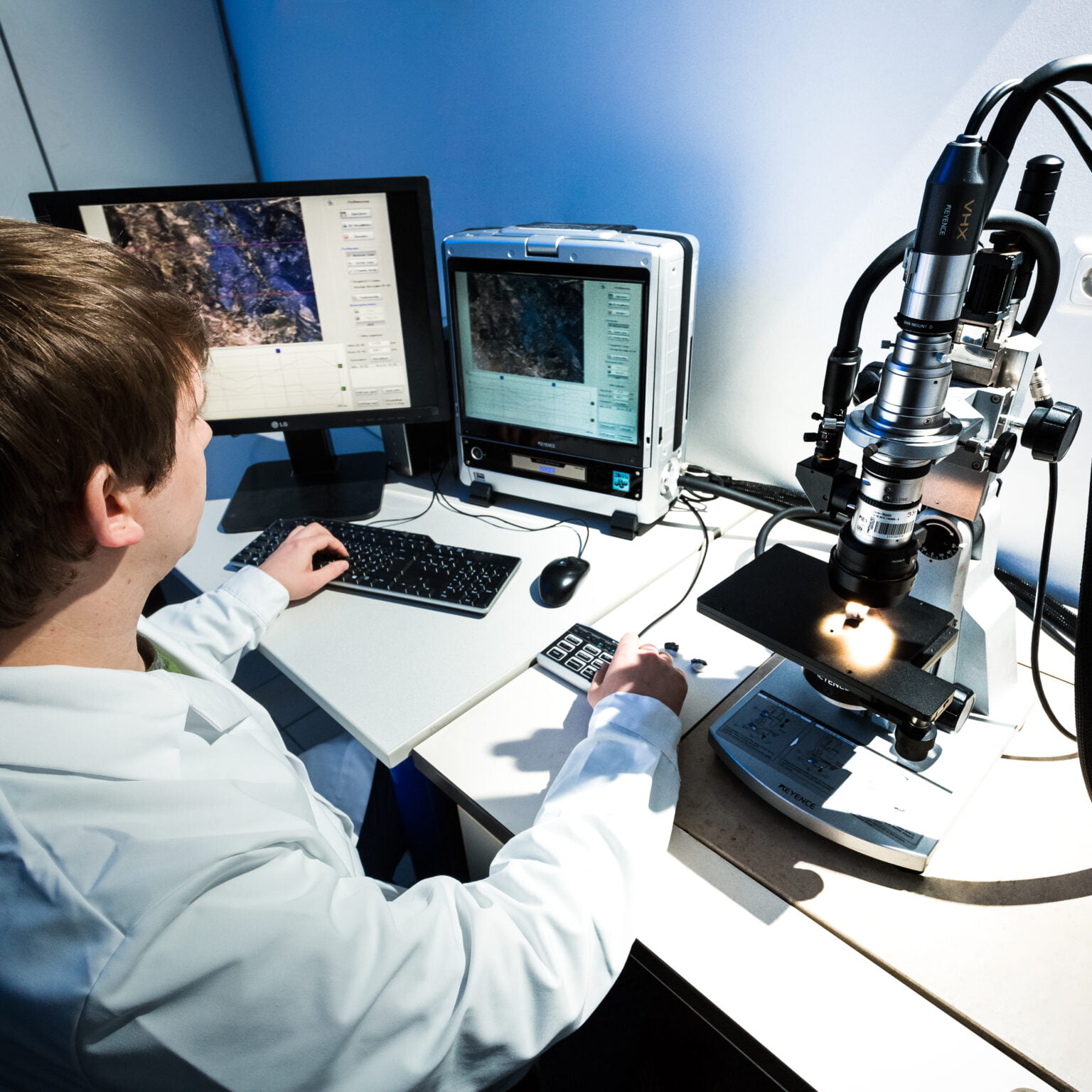 Melt flow electrolytic production of titanium alloys